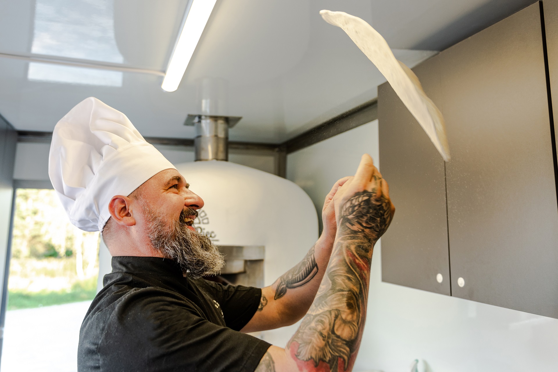 Why Hand-tossed Pizza Is Better | Lone Wolf Pizza Co.